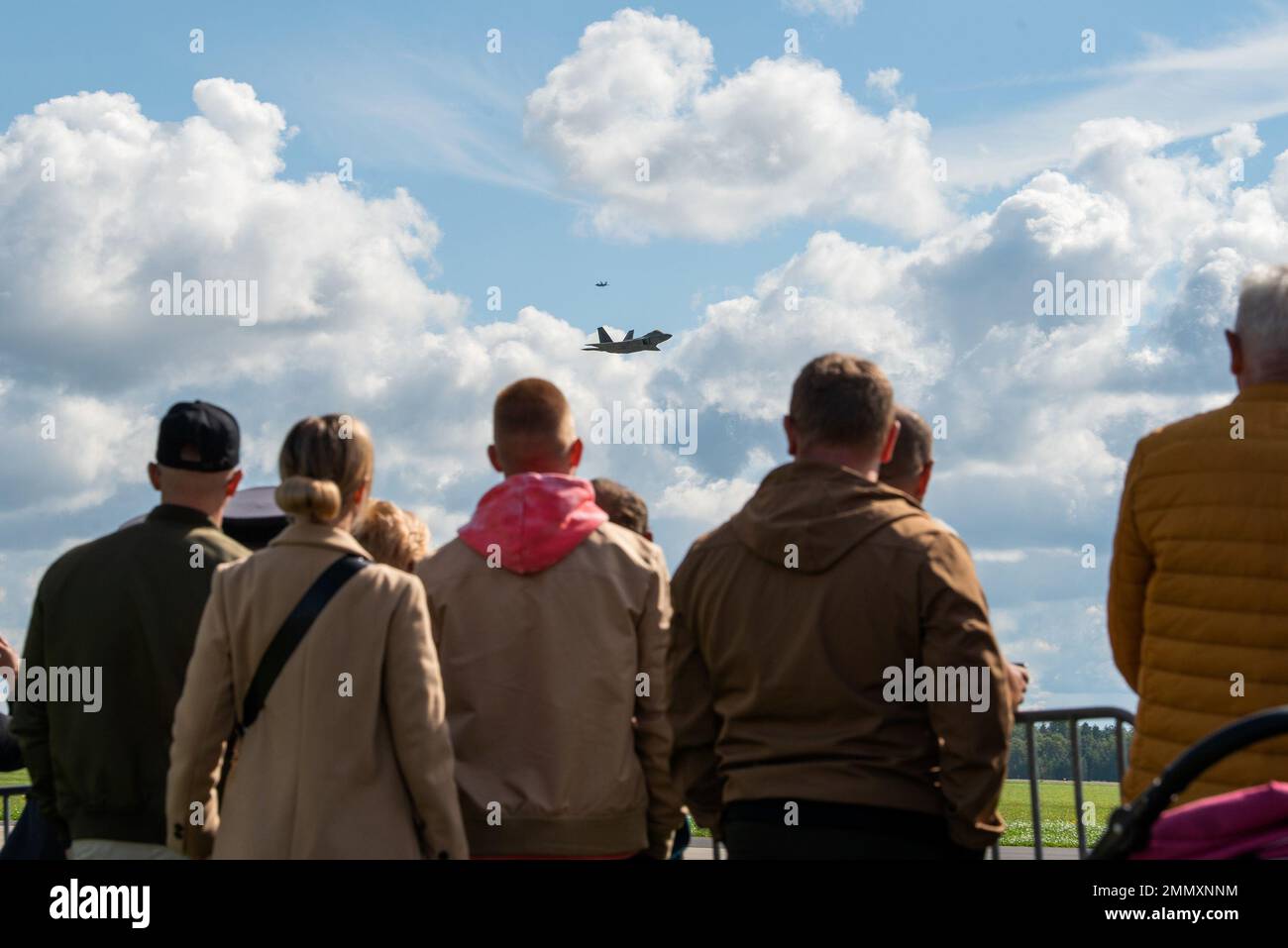 Polish military and community members watch as two U.S. Air Force F-22 ...