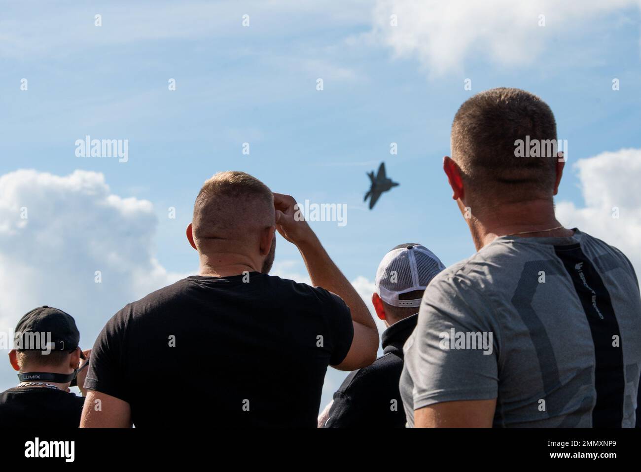 Polish military and community members watch as two U.S. Air Force F-22 ...