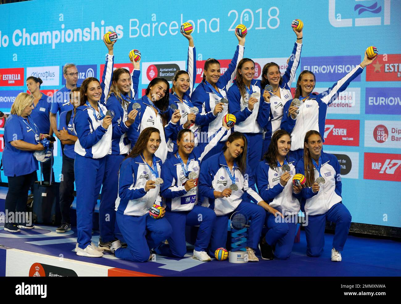 The Greek team pose for a photo with their silver medals after the ...