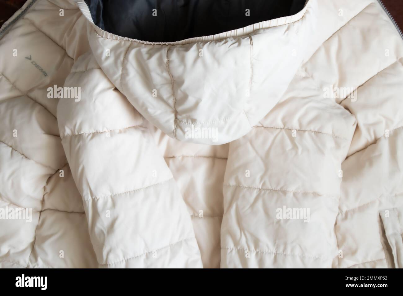 women's padded white soft jacket as background, background of soft ...