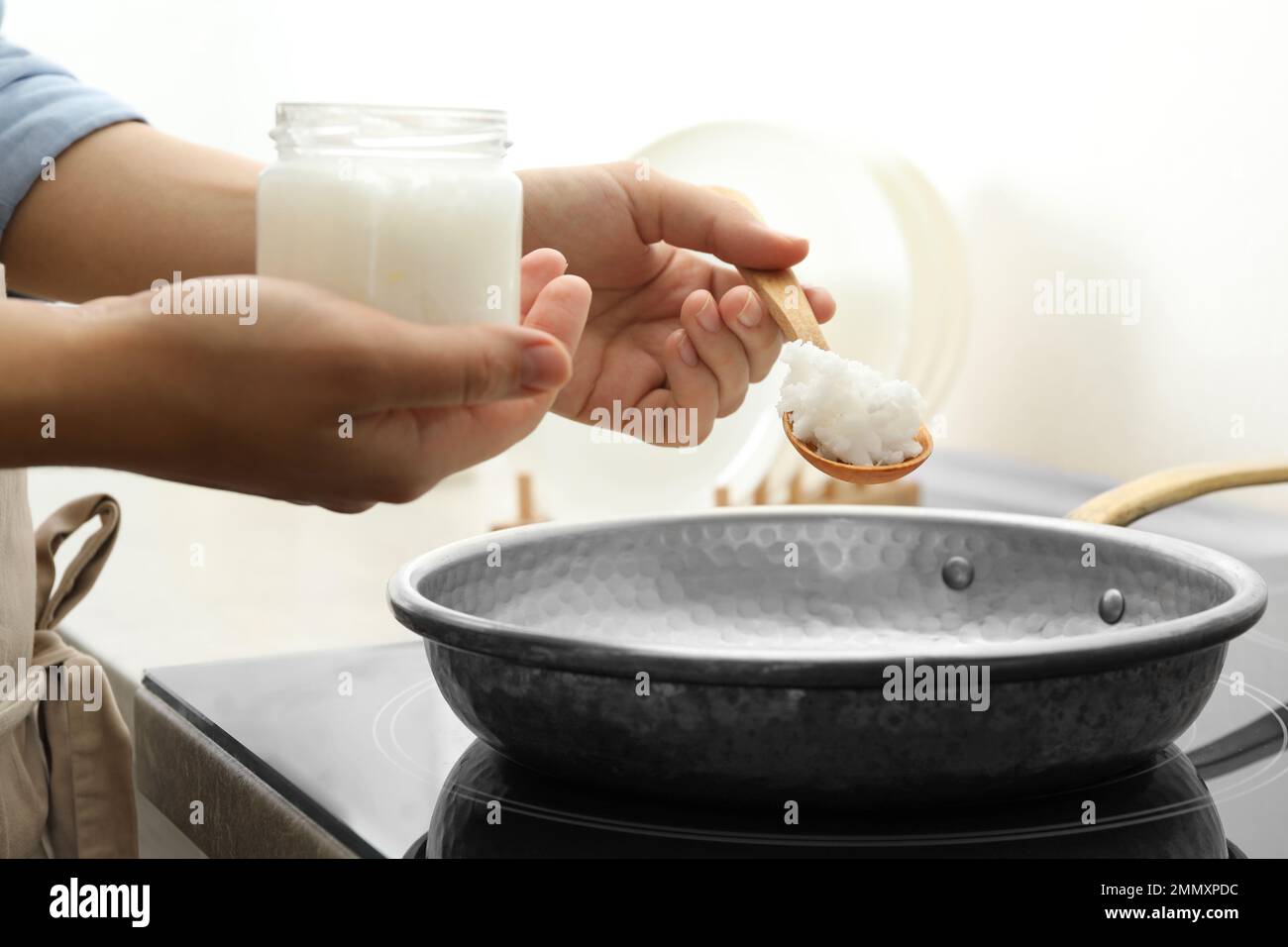 Woman cooking with lard hi-res stock photography and images - Alamy