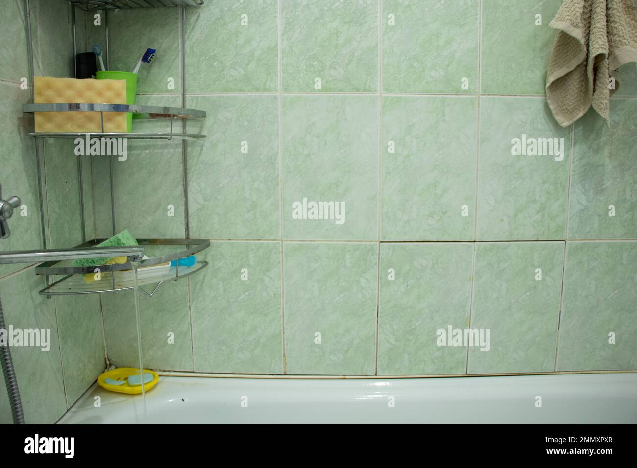 an old bathroom in a Soviet apartment without renovation, a bathroom ...
