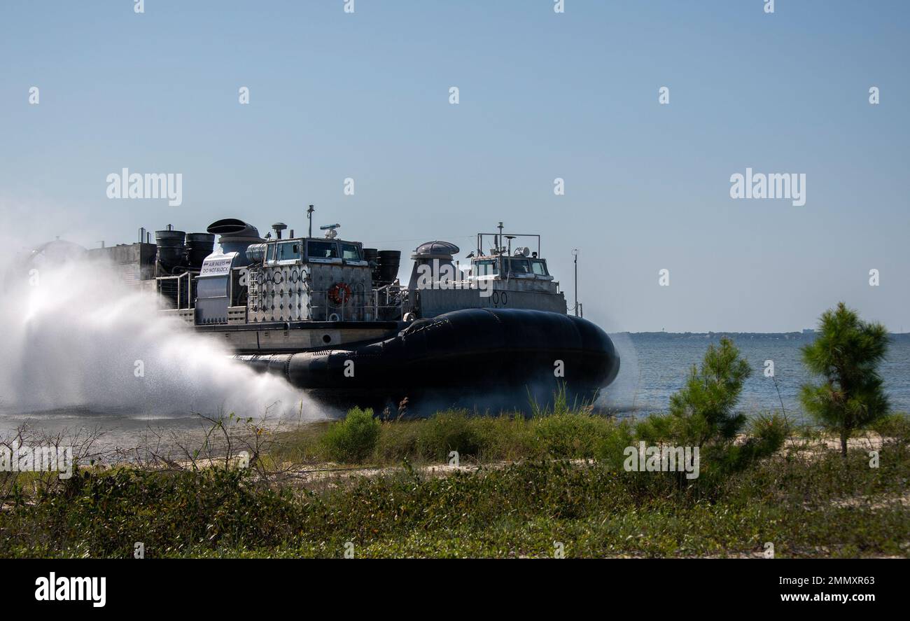 An amphibious Navy Landing Craft Air Cushion vehicle prepares to make ...