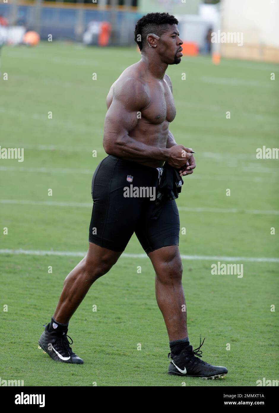 Miami Dolphins defensive end Cameron Wake walks off the field at the ...