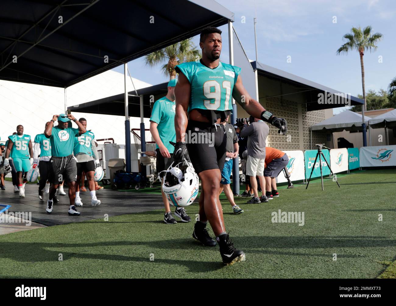 Miami Dolphins defensive end Cameron Wake (91) walks onto the field at ...