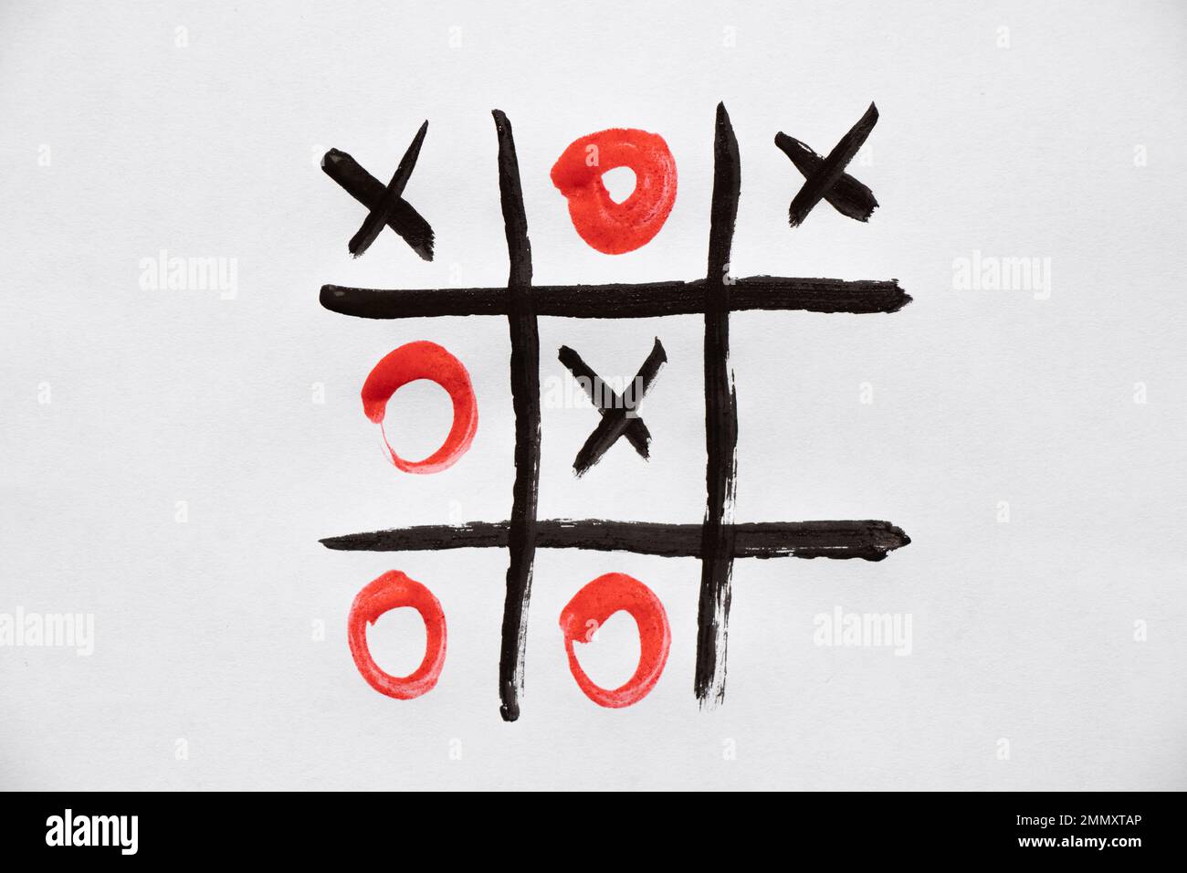 the game of tic-tac-toe is drawn on paints on white paper, play and ...