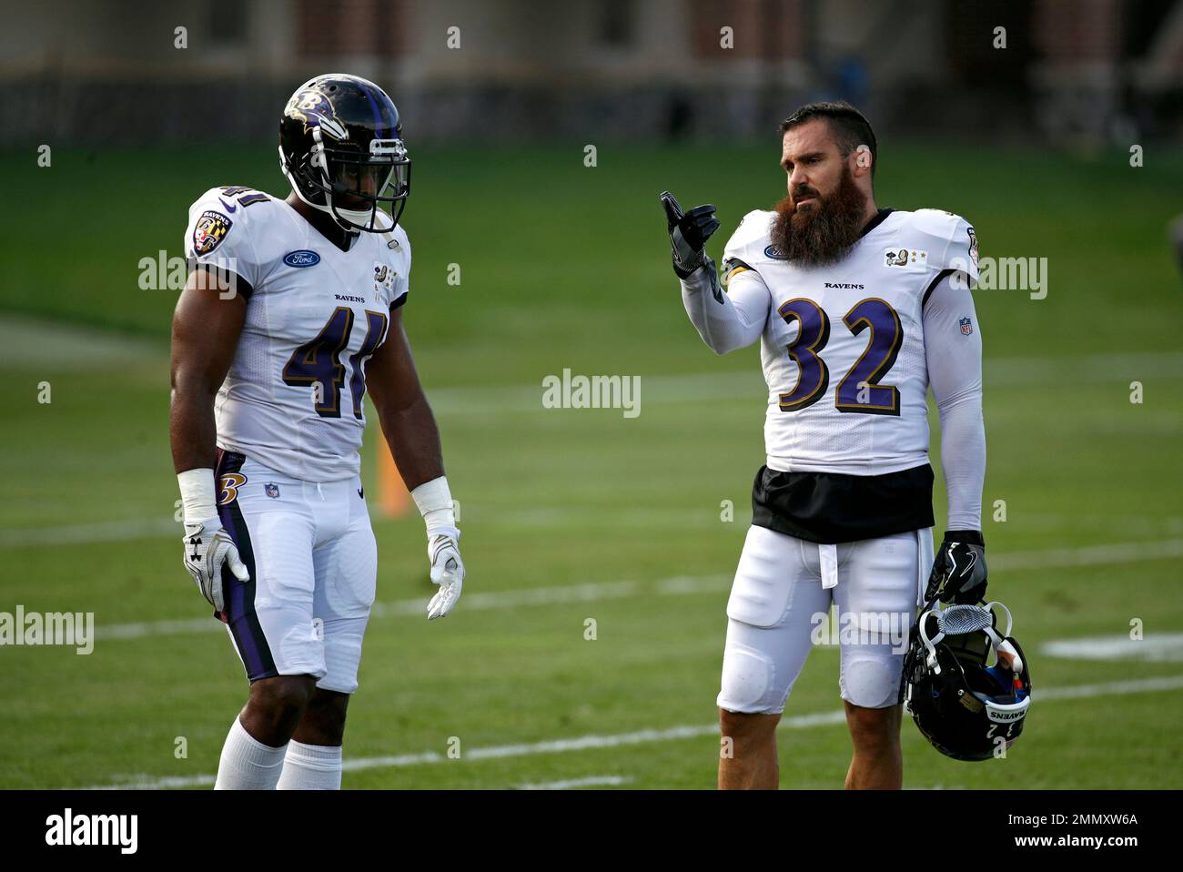 Baltimore Ravens safety Eric Weddle, right, speaks with teammate ...