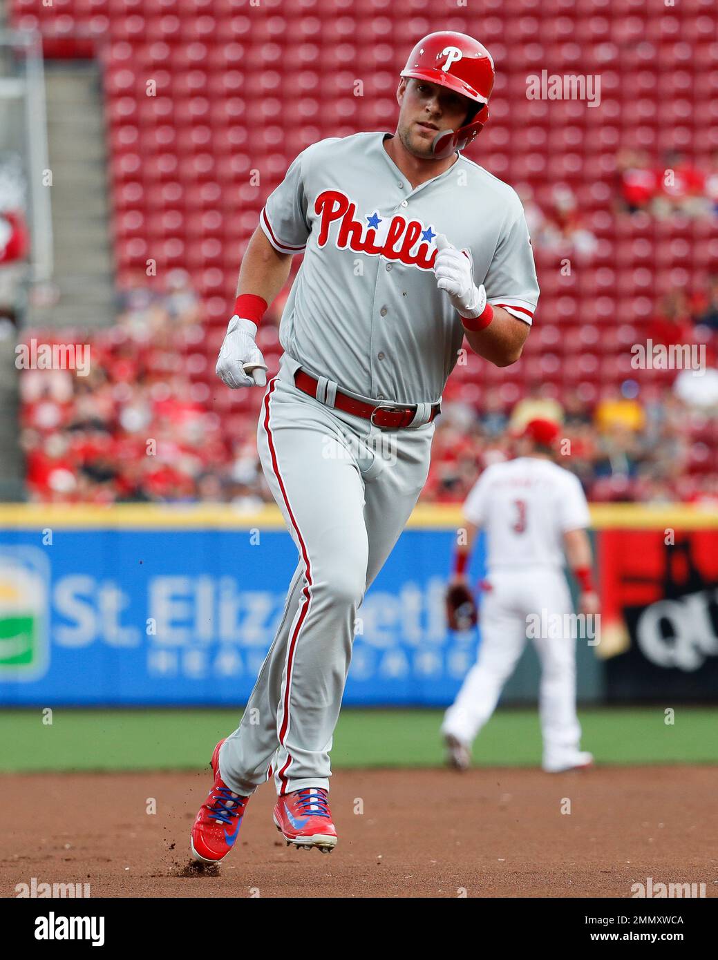 Philadelphia Phillies' Rhys Hoskins runs the bases after hitting a solo ...