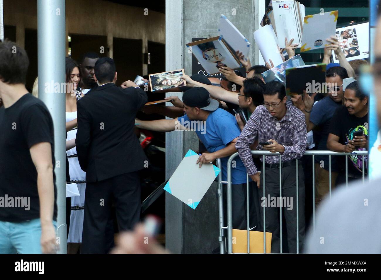 Mandy Moore signs autographs to her fans as she arrives at the LA ...