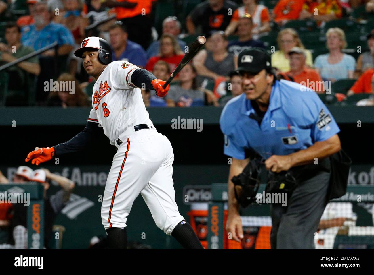 Baltimore Orioles' Jonathan Schoop, left, and umpire Phil Cuzzi watch ...