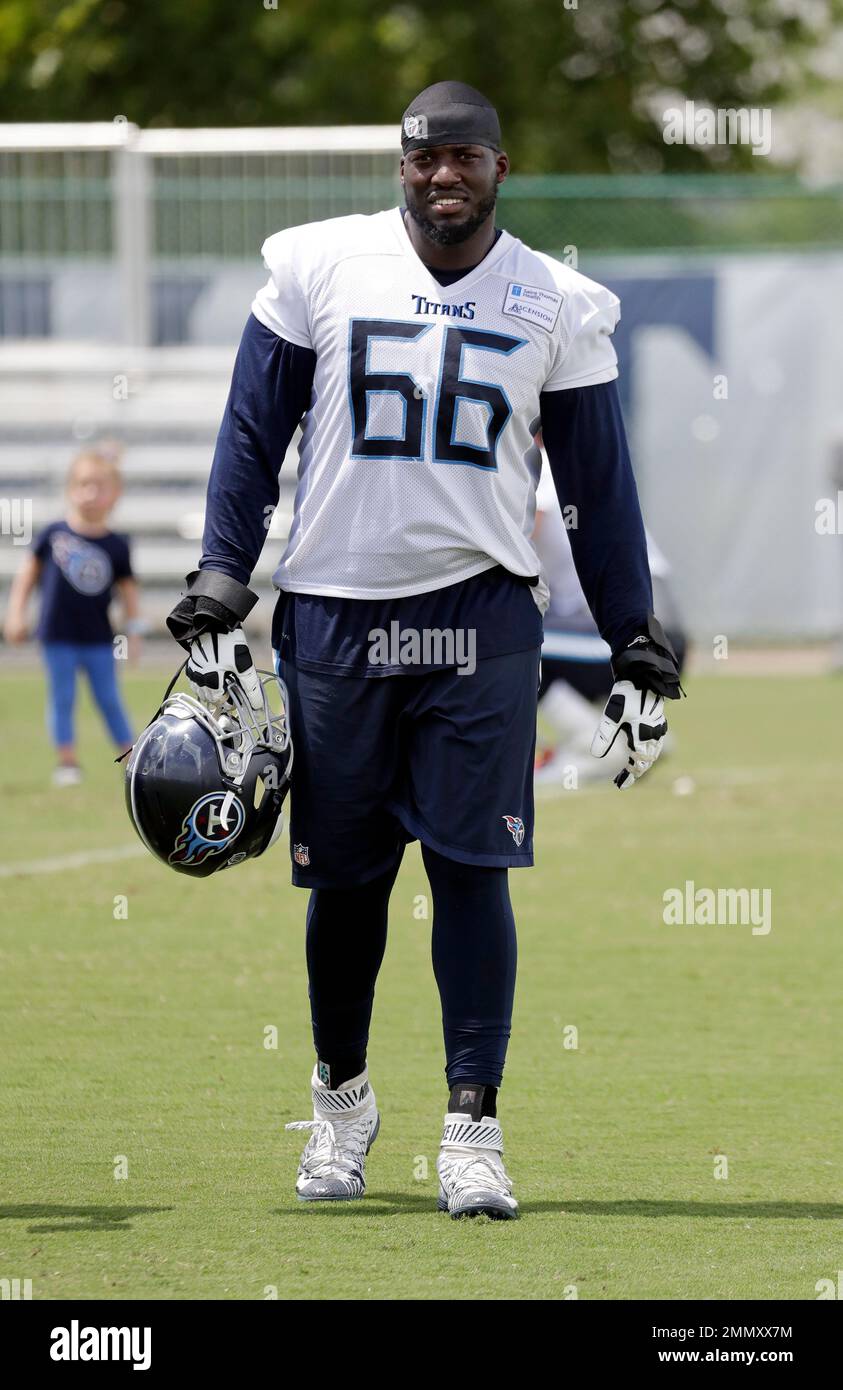 Tennessee Titans offensive guard Kevin Pamphile leaves the field after ...