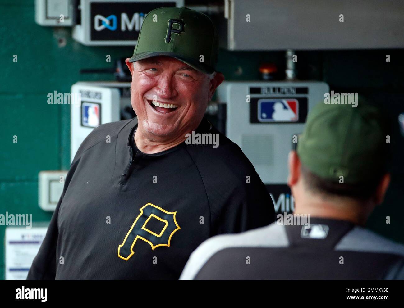 Pittsburgh Pirates manager Clint Hurdle, left, laughs with bench coach ...