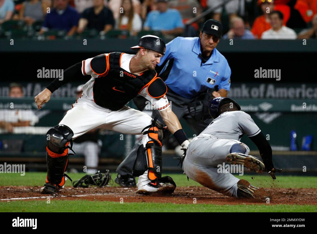 Baltimore Orioles catcher Caleb Joseph, left, tags out Tampa Bay Rays ...