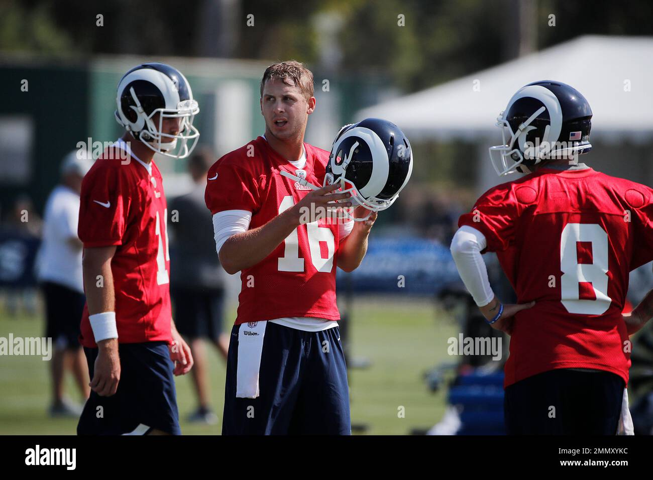 Los Angeles Rams quarterback Jared Goff, center, takes off his helmet ...