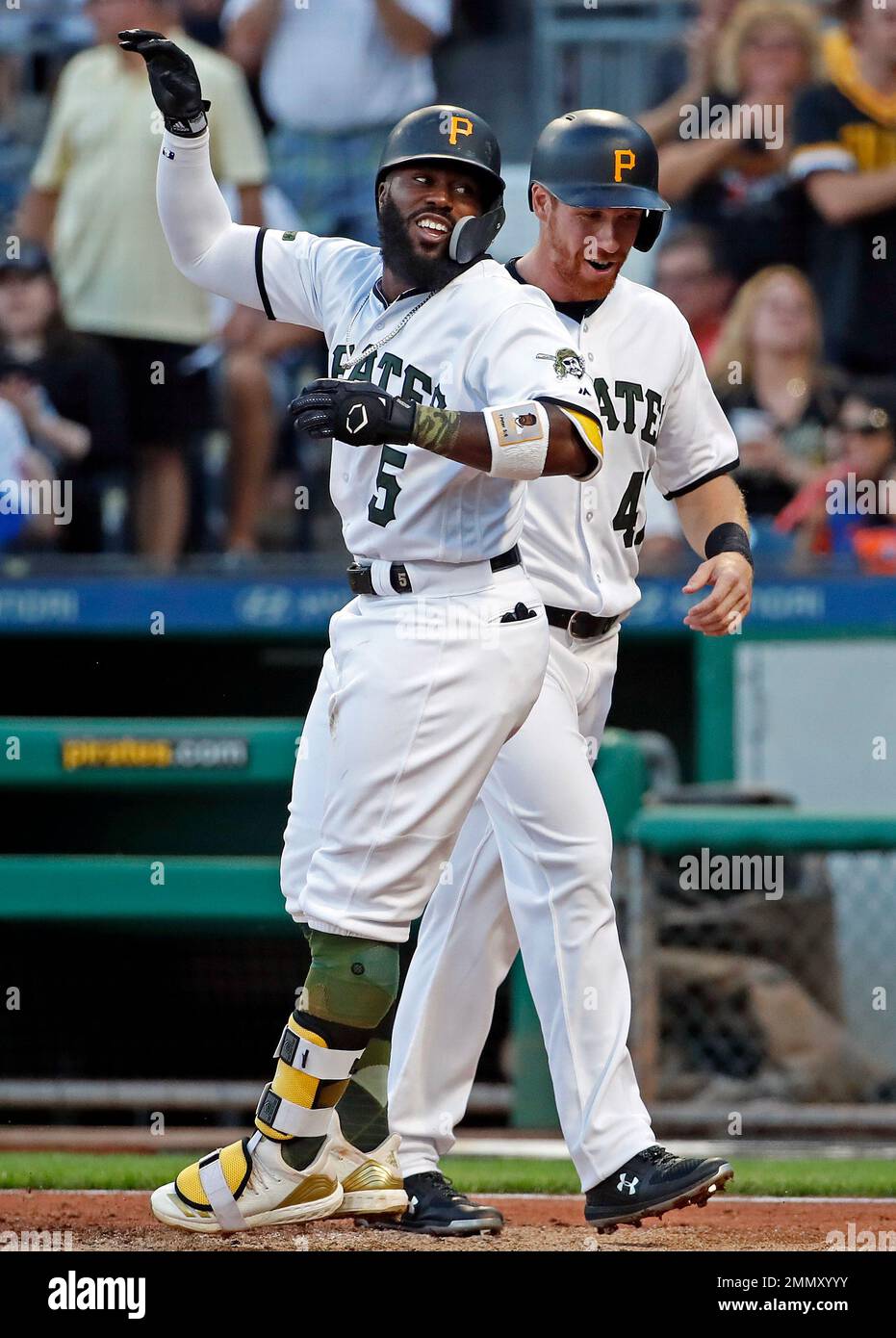 Pittsburgh Pirates' Josh Harrison, left, celebrates with Jordan Luplow ...