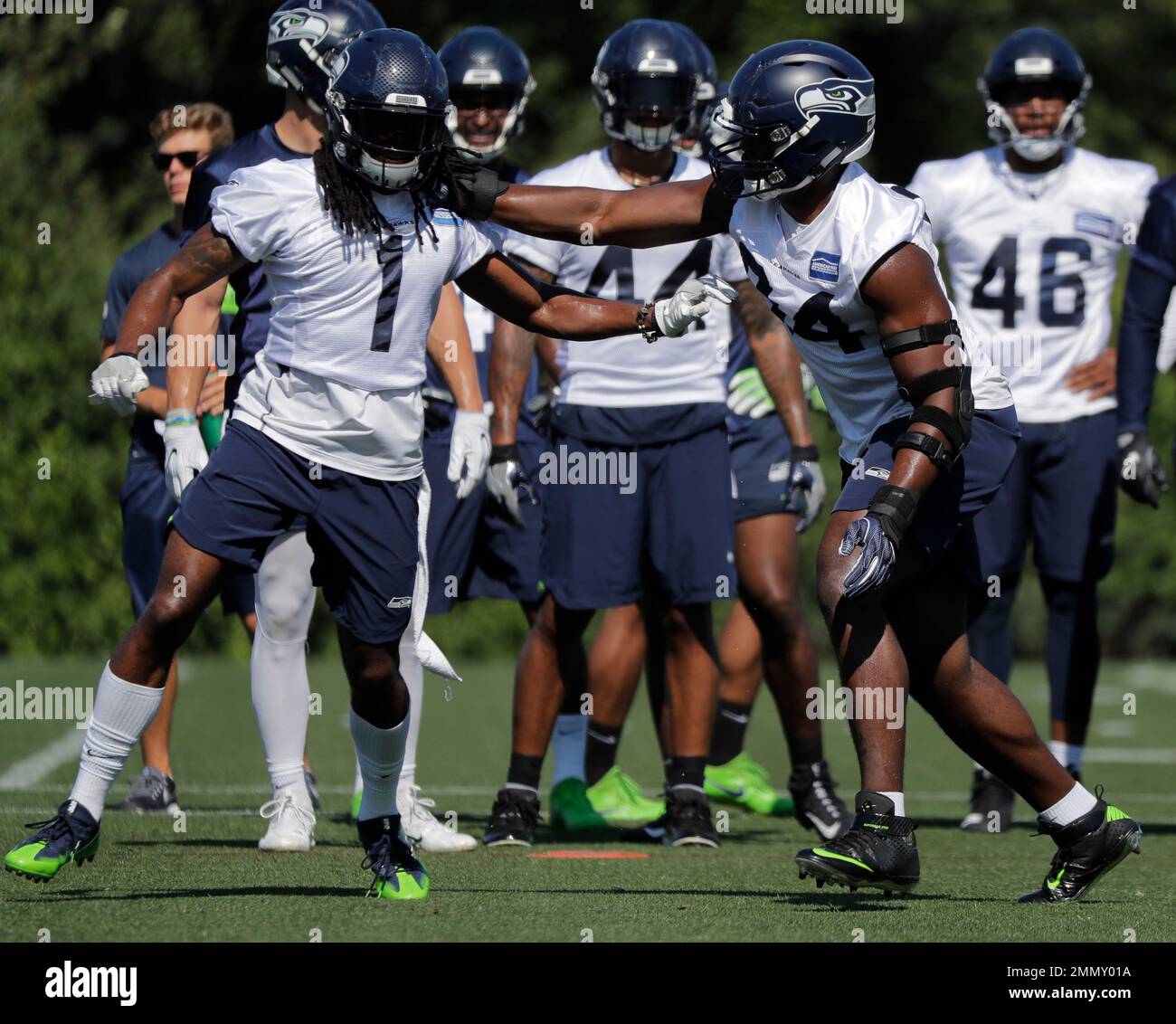 Seattle Seahawks cornerback Alex Carter (1) and defensive end Rasheem ...