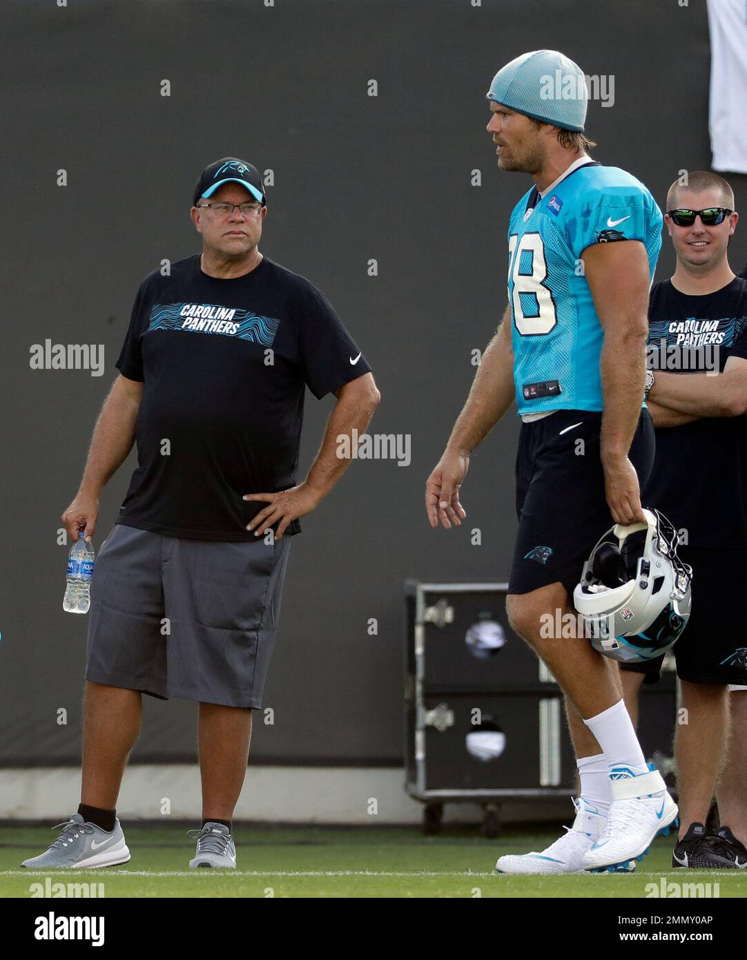 Carolina Panthers owner David Tepper, left, watches as Greg Olsen walks ...