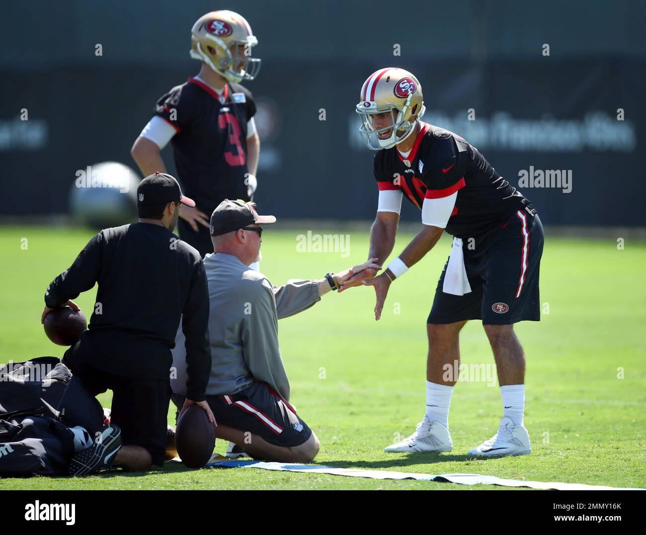 San Francisco 49ers quarterback Jimmy Garoppolo, right, prepares to ...
