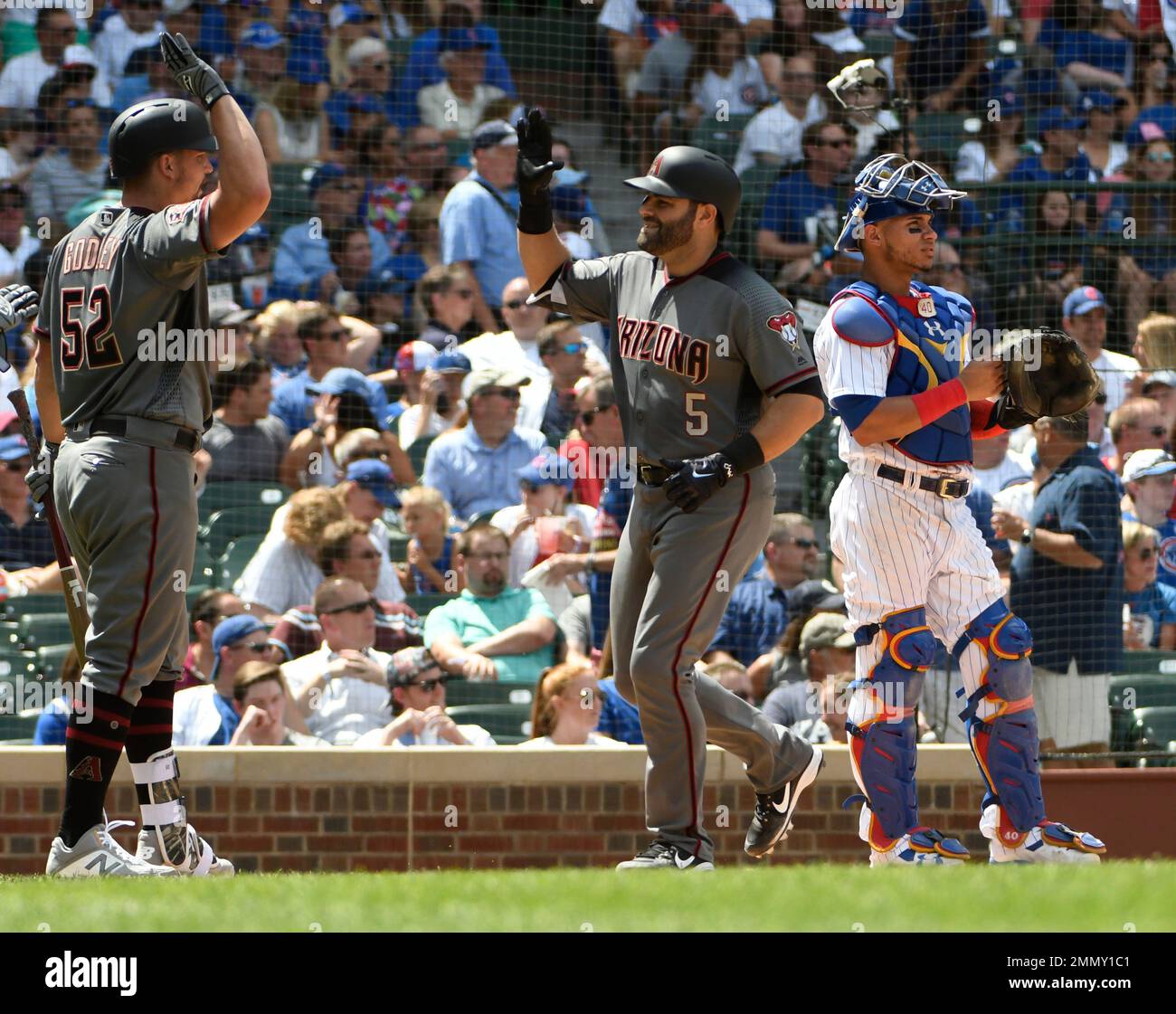 Arizona Diamondbacks' Alex Avila (5) is greeted by Zack Godley (52 ...