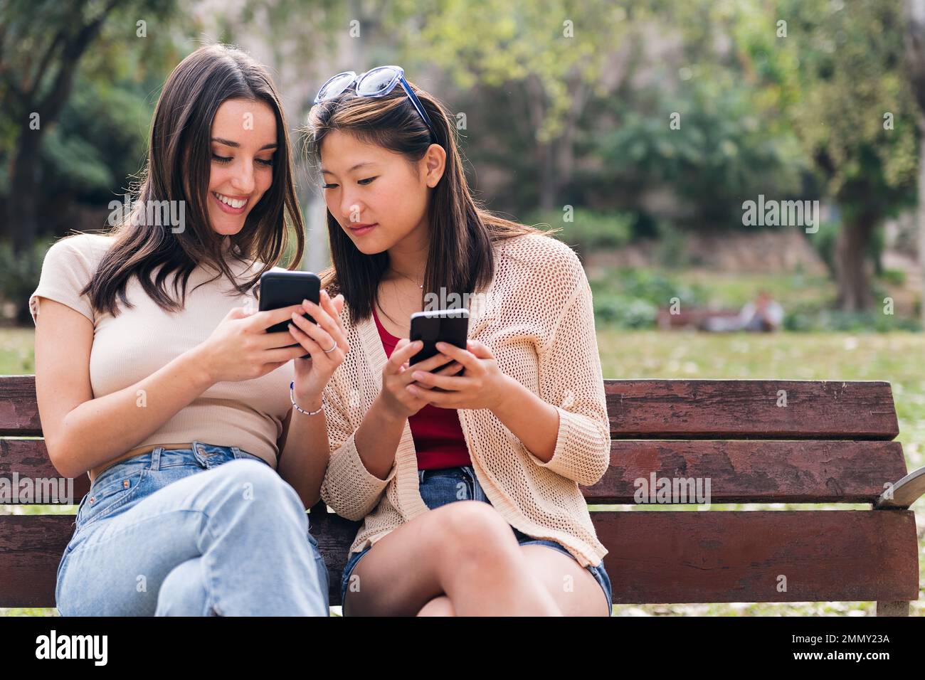 Youth looking at phones hi-res stock photography and images - Alamy