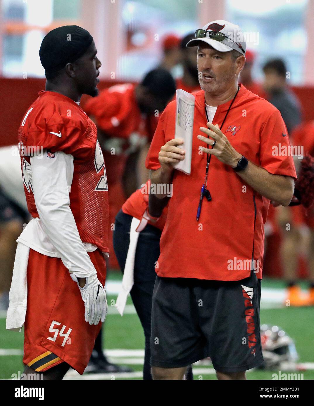 Tampa Bay Buccaneers head coach Dirk Koetter, right, talks to ...