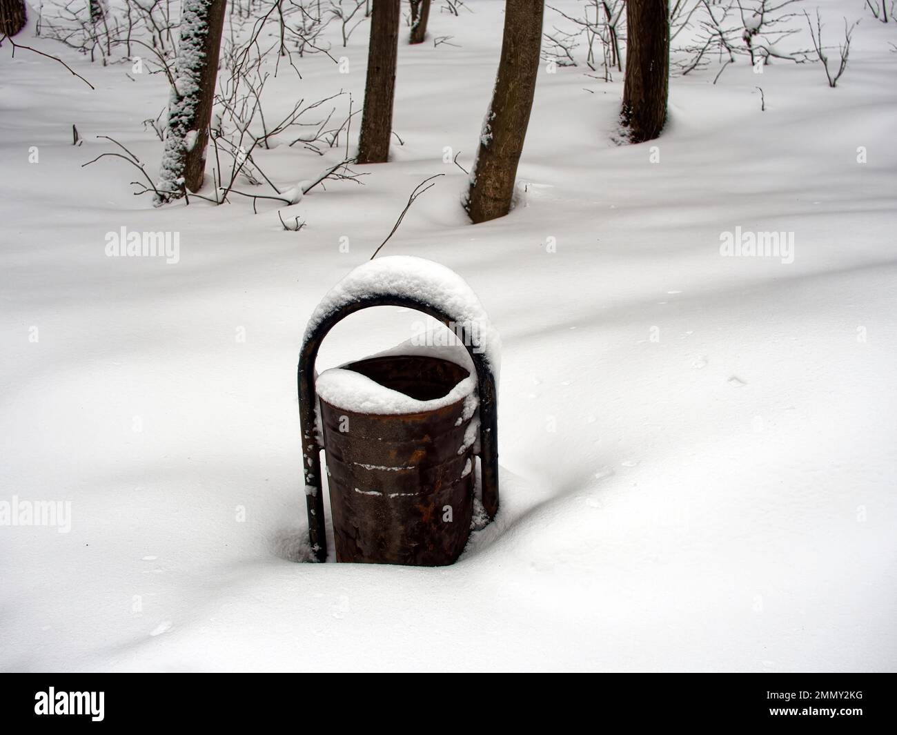 garbage can covered with snow, in the park Stock Photo - Alamy