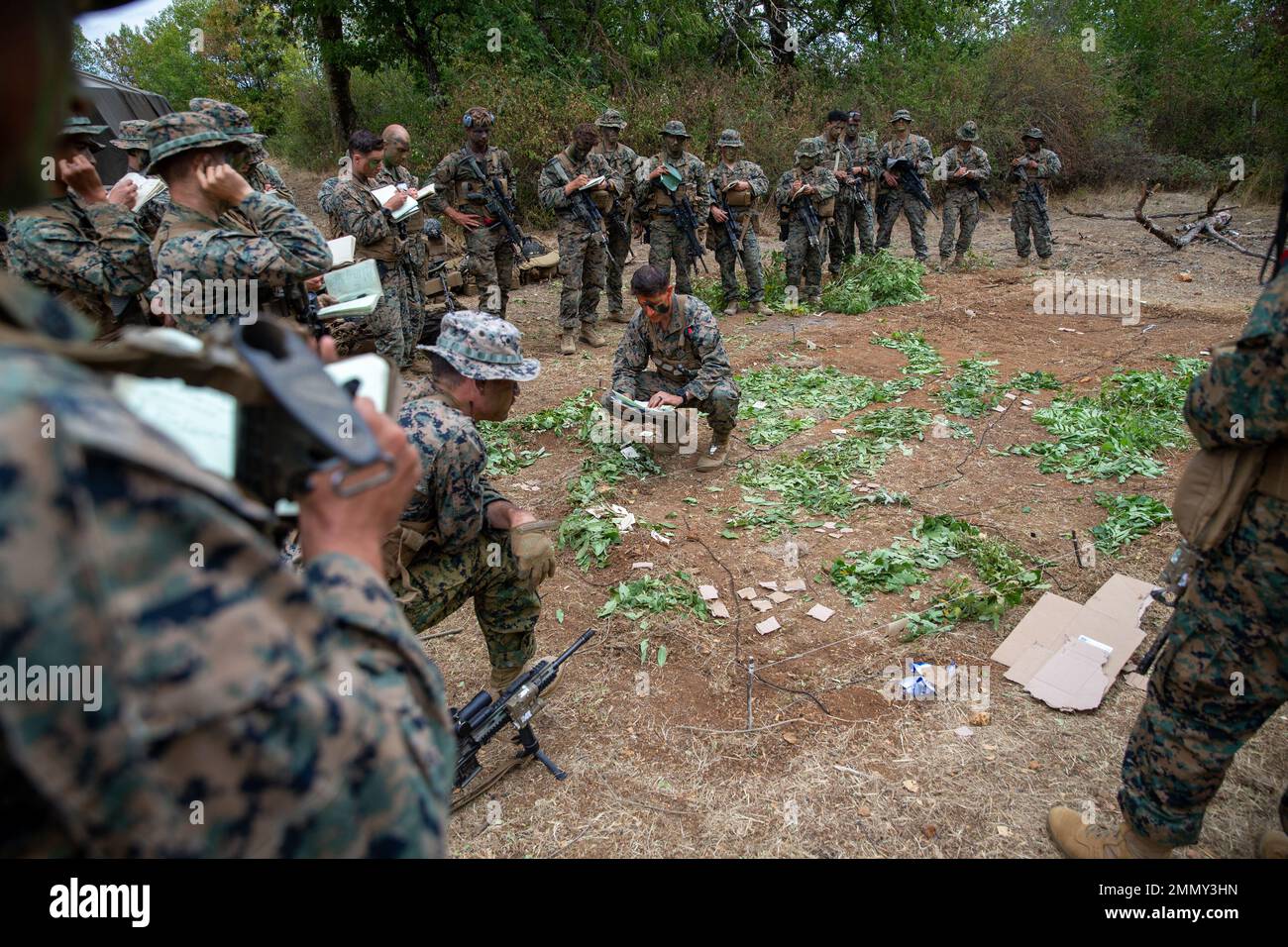 U.S. Marines with 2d Battalion, 8th Marine Regiment, 2d Marine Division, gather around a terrain ...