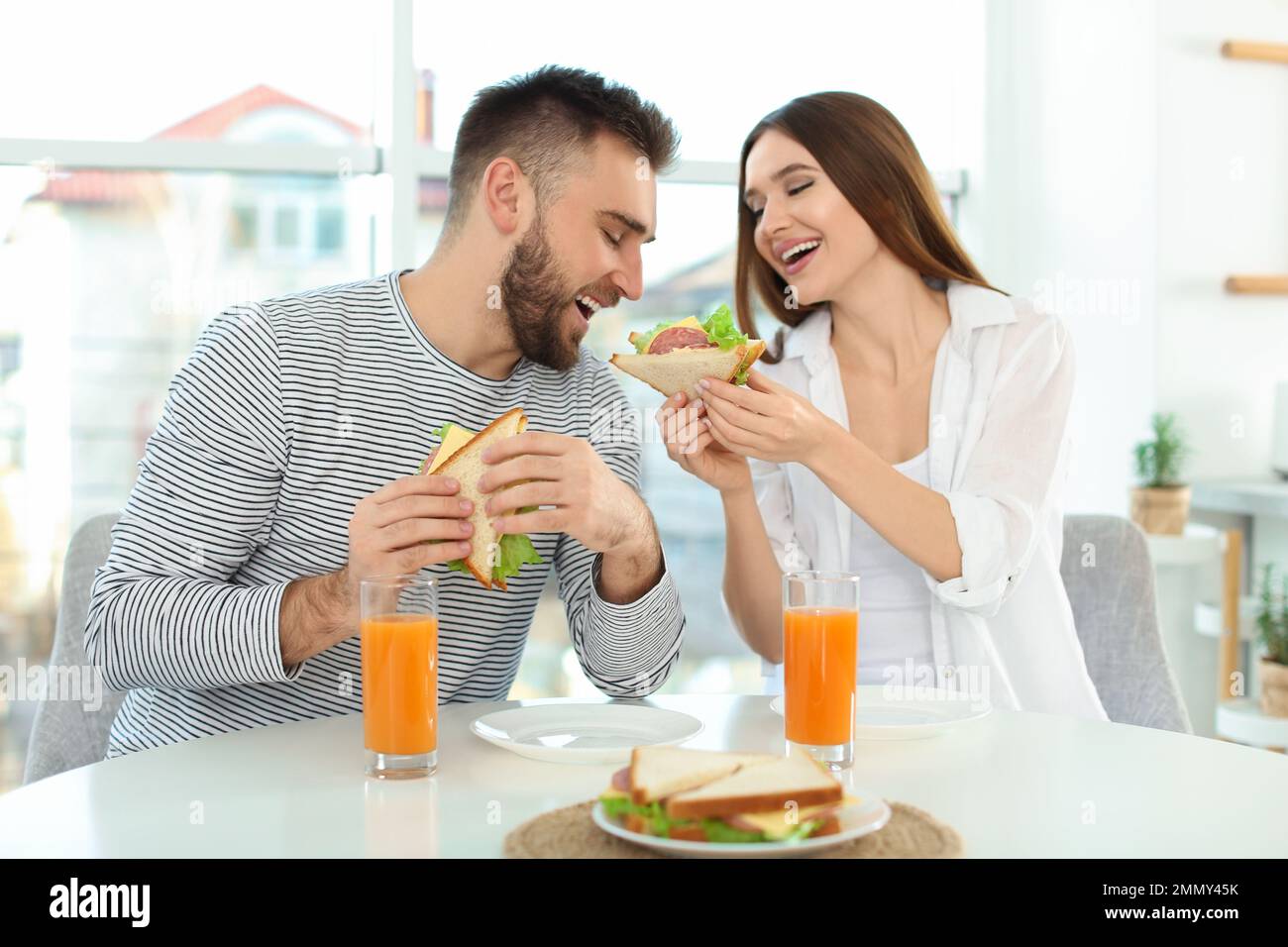 Cute happy family having breakfast hi-res stock photography and images ...