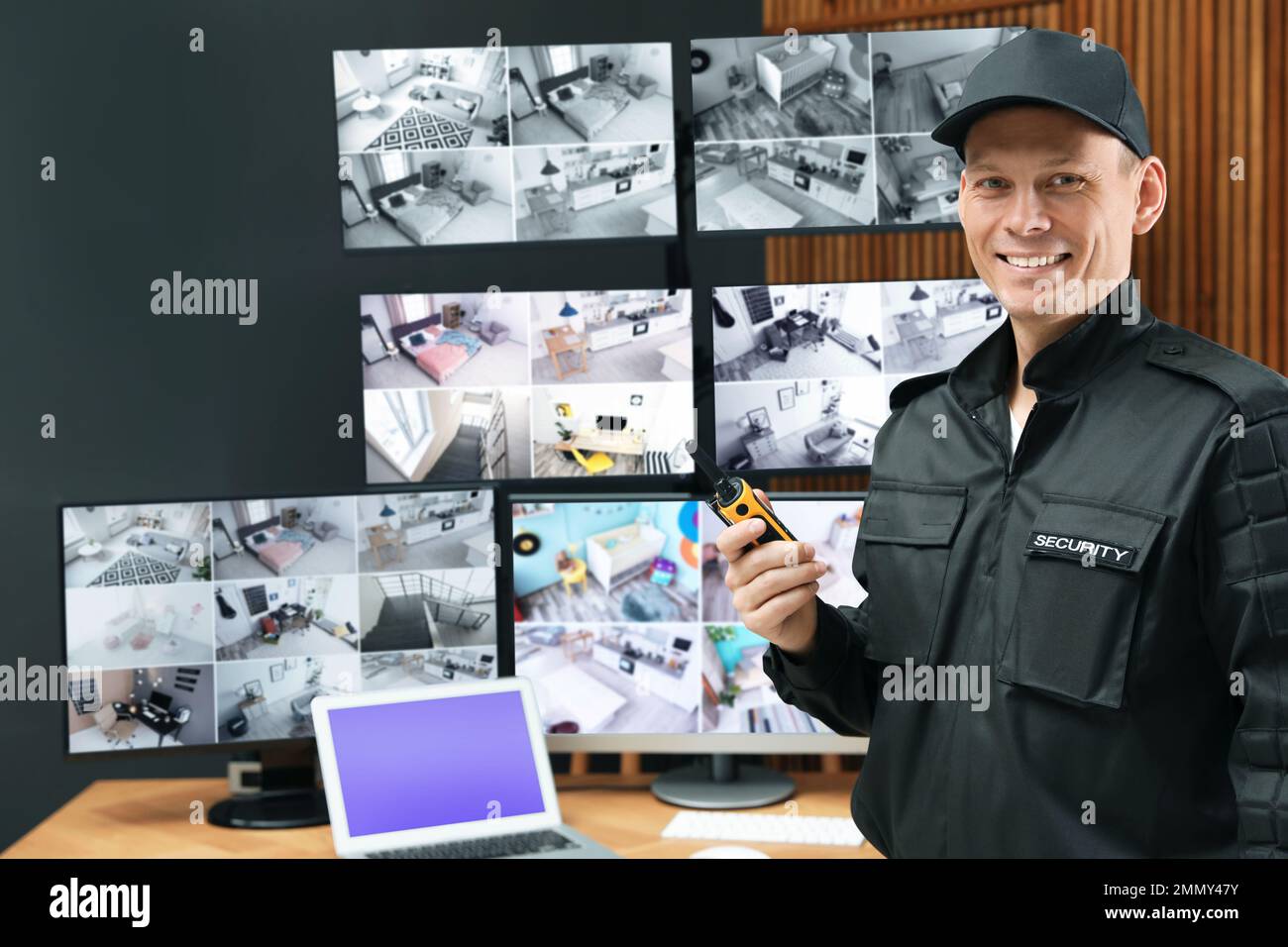 Security guard with portable transmitter at workplace in office Stock ...