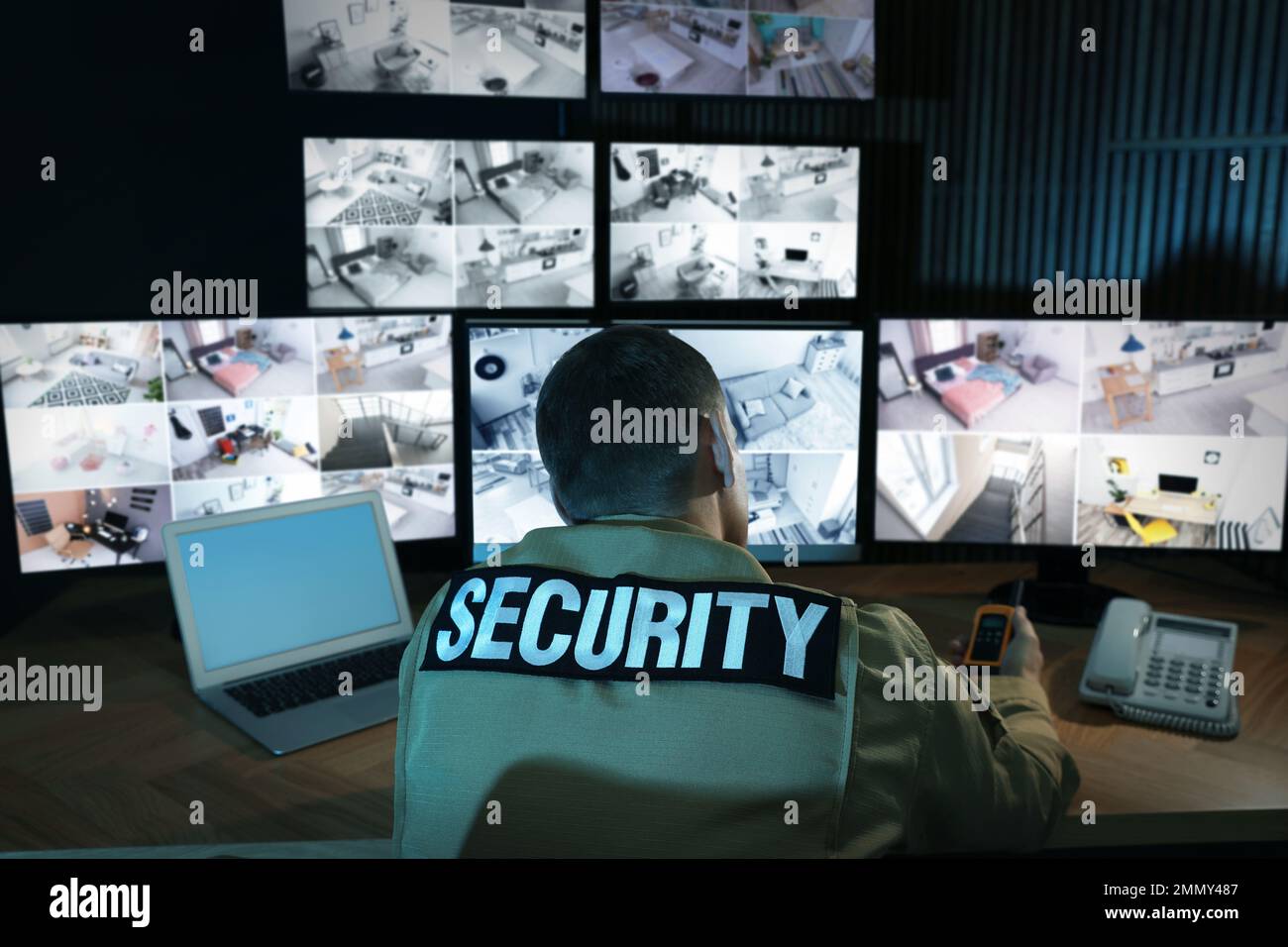 Security guard monitoring modern CCTV cameras in office Stock Photo - Alamy
