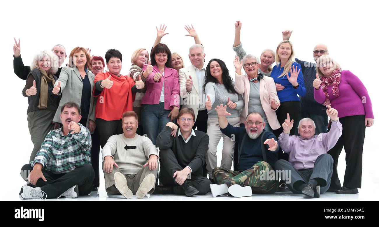in full growth. groups of happy mature people showing their success ...