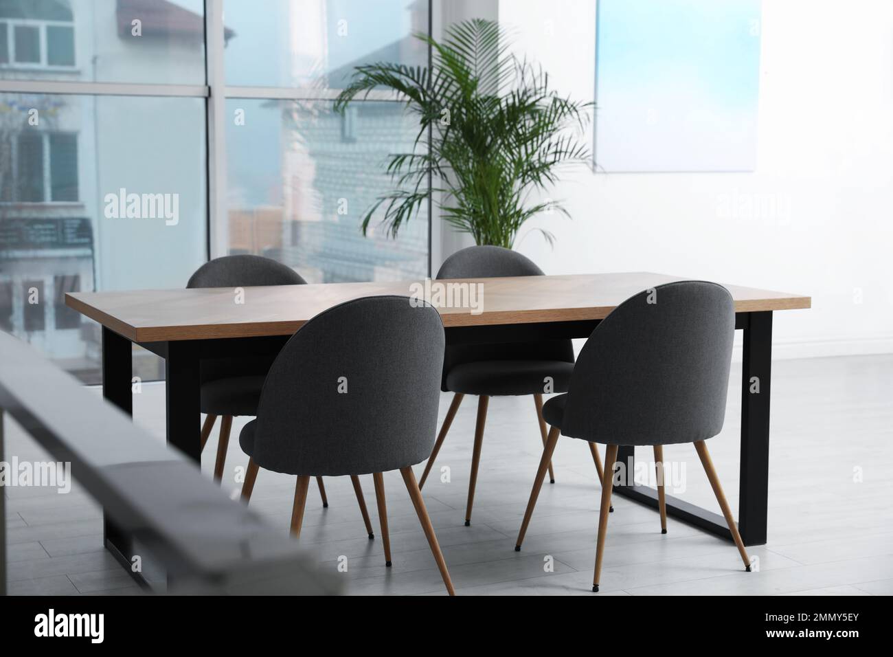 Modern room interior with chairs and table Stock Photo - Alamy