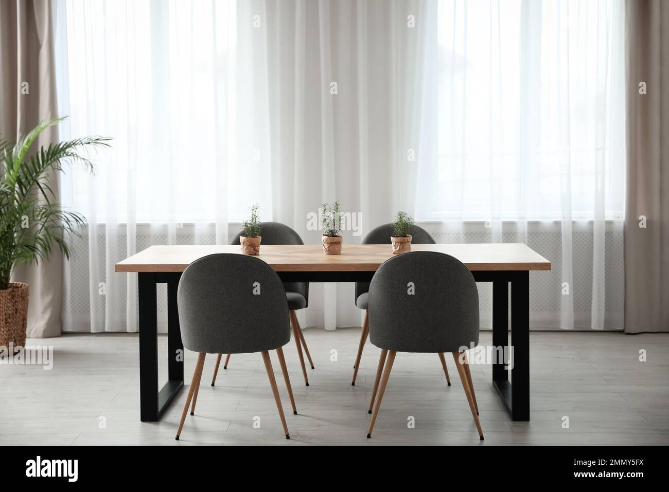 Modern room interior with chairs and table Stock Photo - Alamy