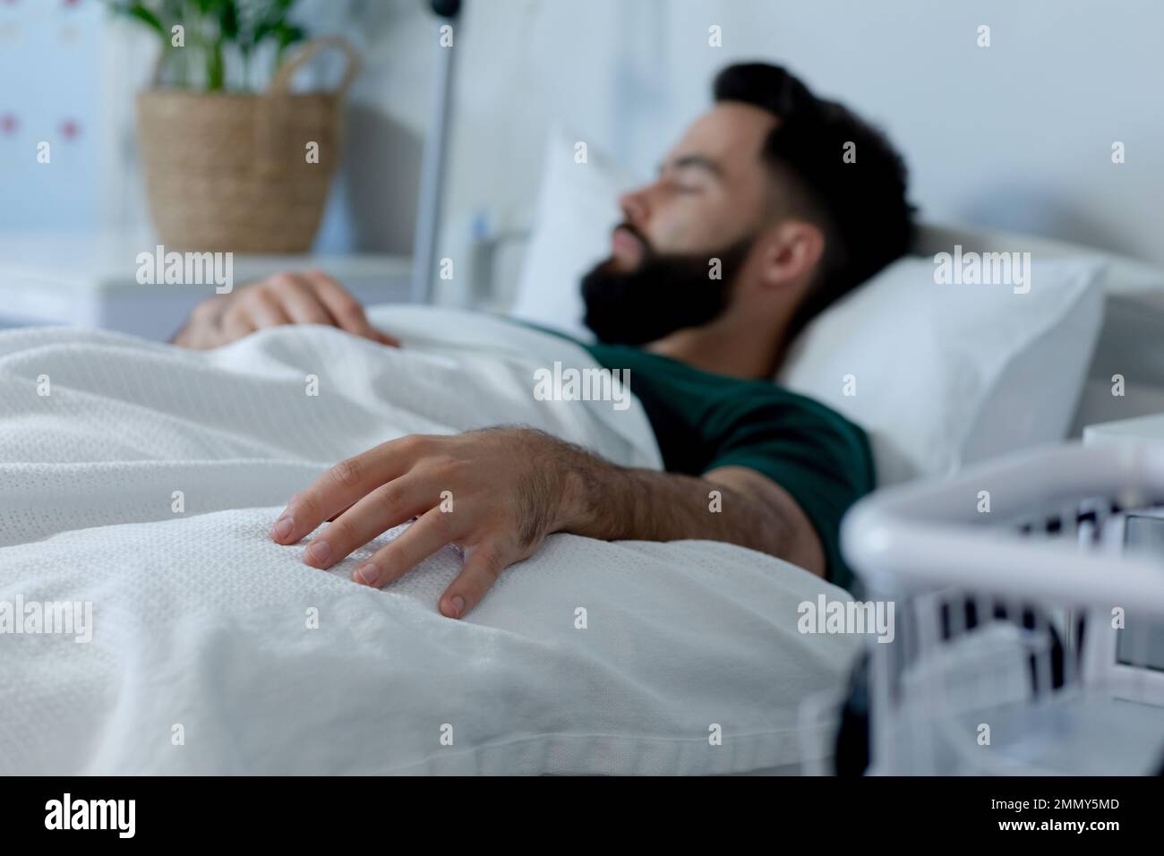 Caucasian male patient lying in bed and sleeping at hospital Stock ...