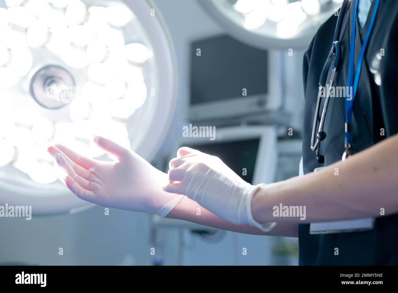 Caucasian female surgeon in an operating theatre, wearing medical ...