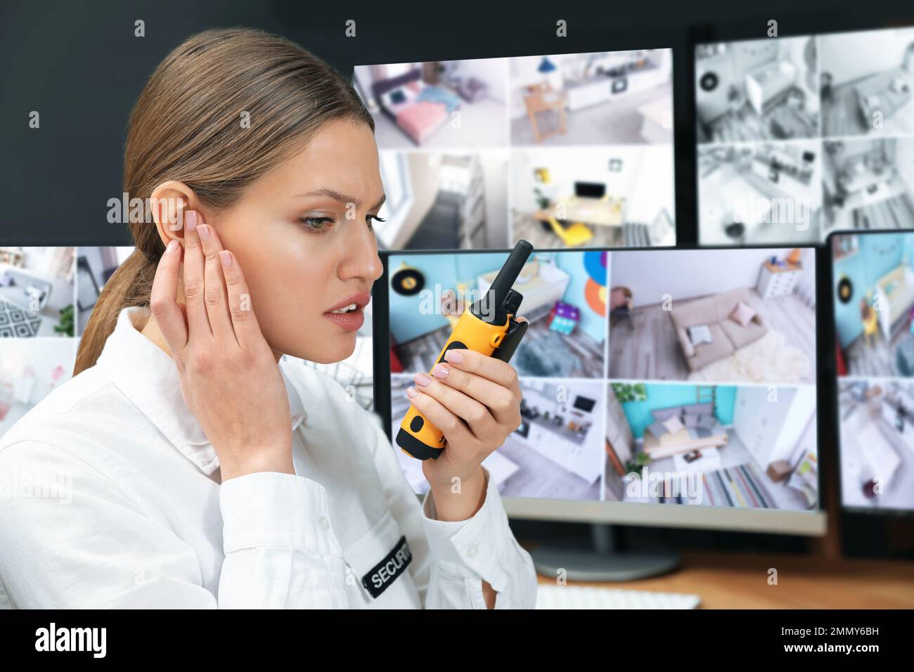 Emotional security guard using portable transmitter at workplace Stock ...