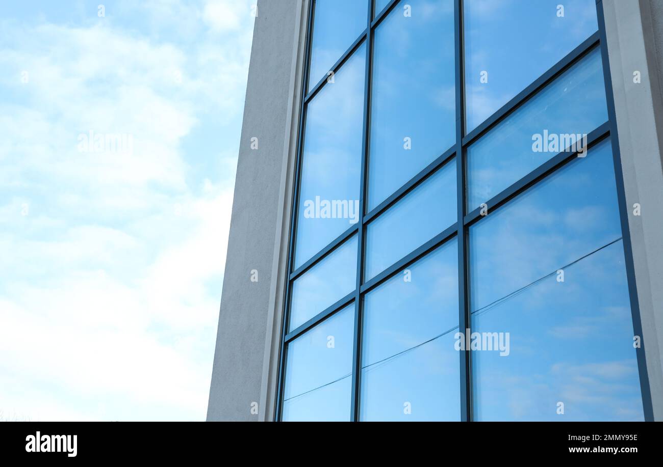 New modern building with tinted windows outdoors Stock Photo - Alamy