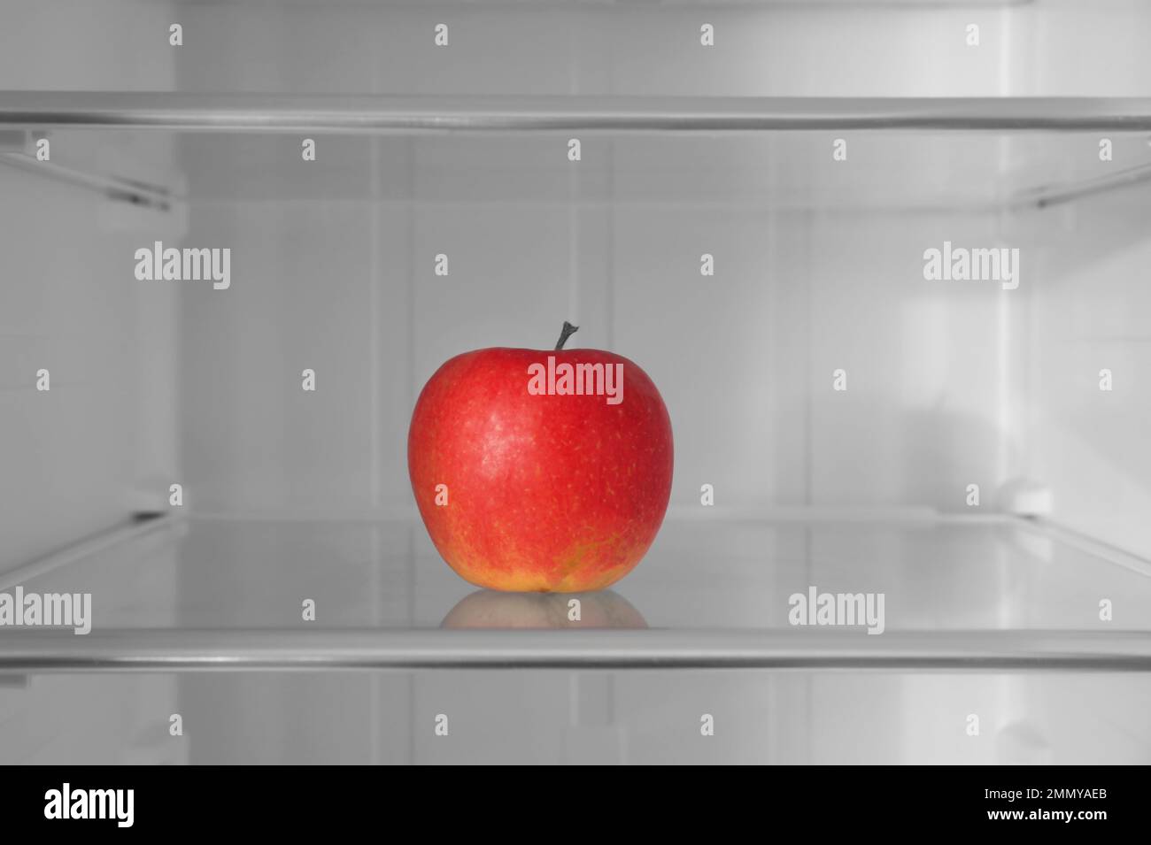 Red apple on shelf inside modern refrigerator Stock Photo - Alamy