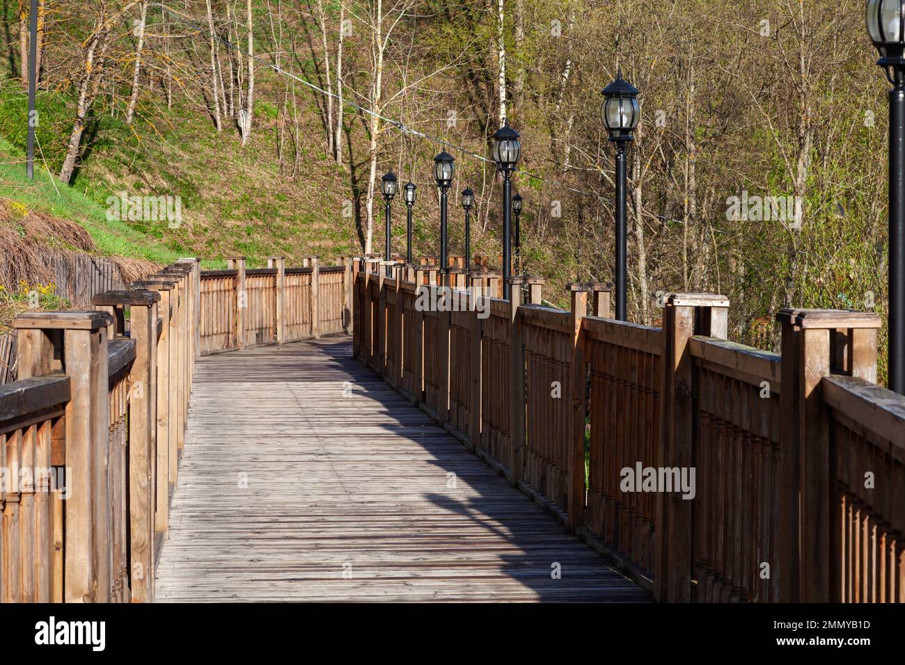 Scenic wood flooring with iron street lights Stock Photo - Alamy
