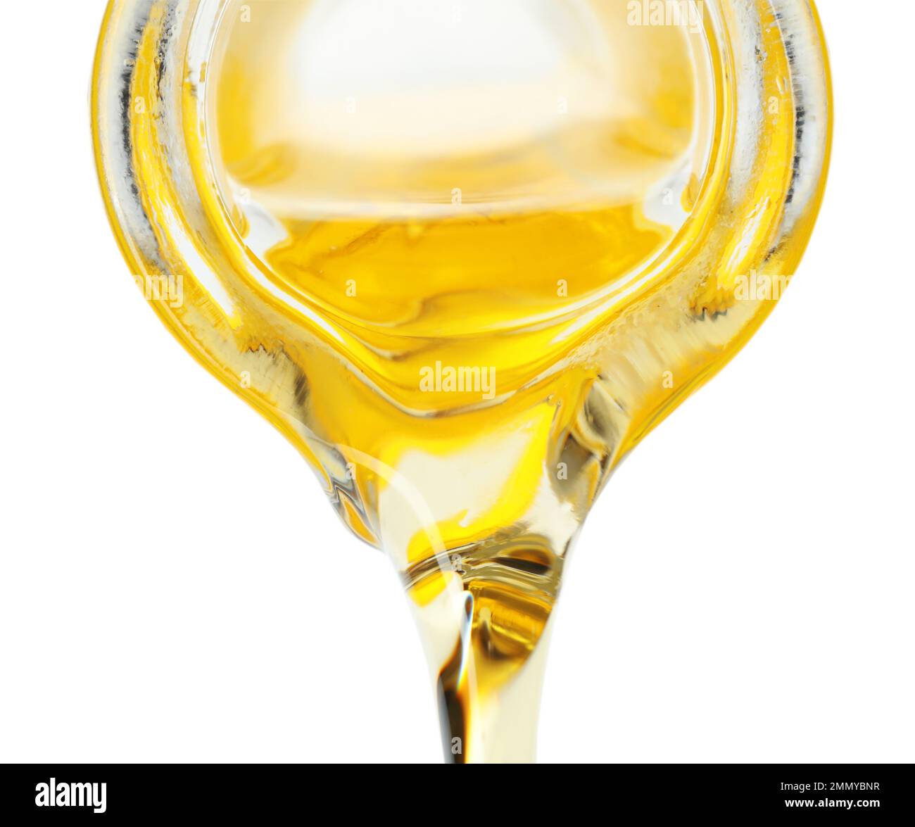 Pouring cooking oil from pitcher isolated on white Stock Photo - Alamy