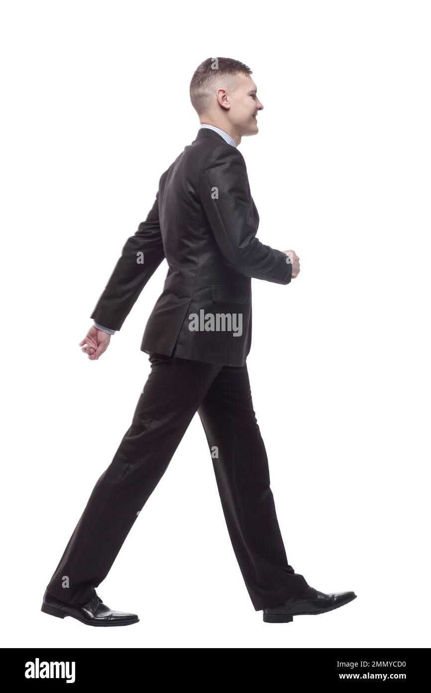 in full growth. young businessman confidently striding forward ...