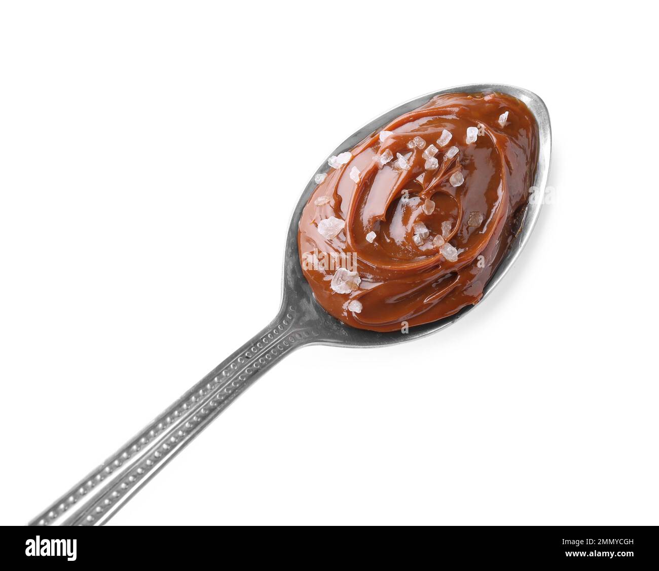 Salted caramel in spoon isolated on white Stock Photo - Alamy