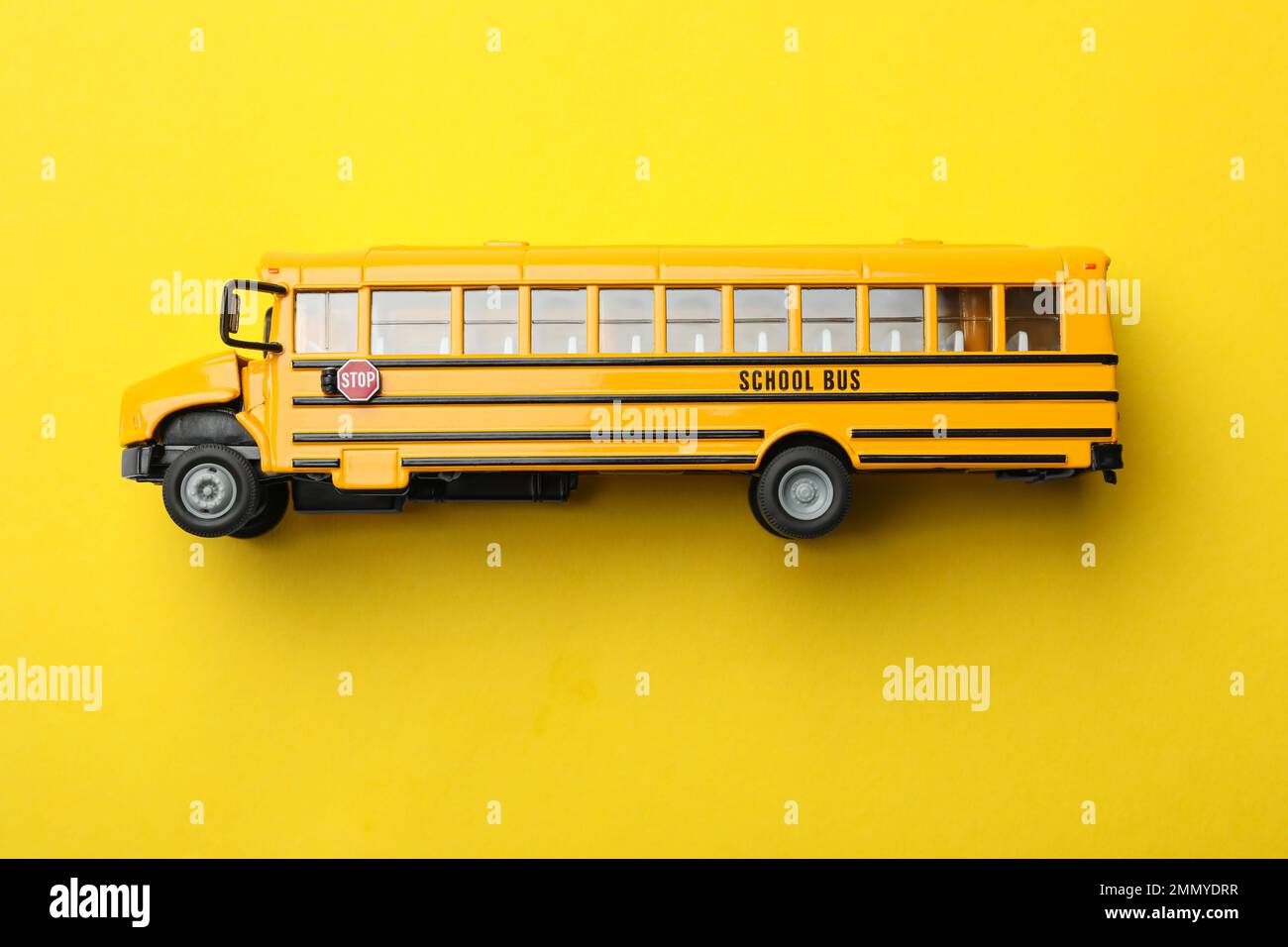 School bus on yellow background, top view. Transport for students Stock ...
