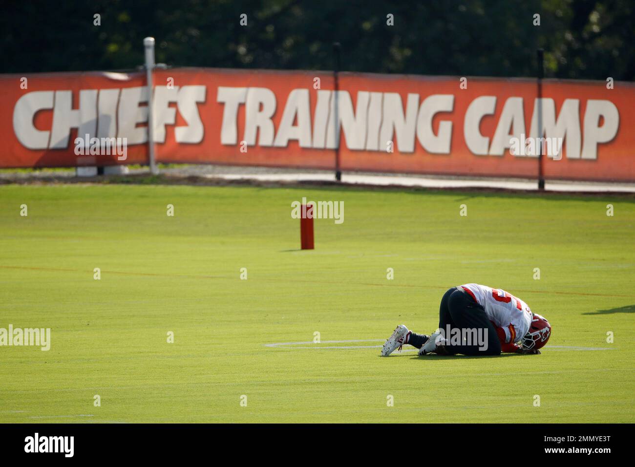Kansas City Chiefs safety Armani Watts lays on the ground after an ...