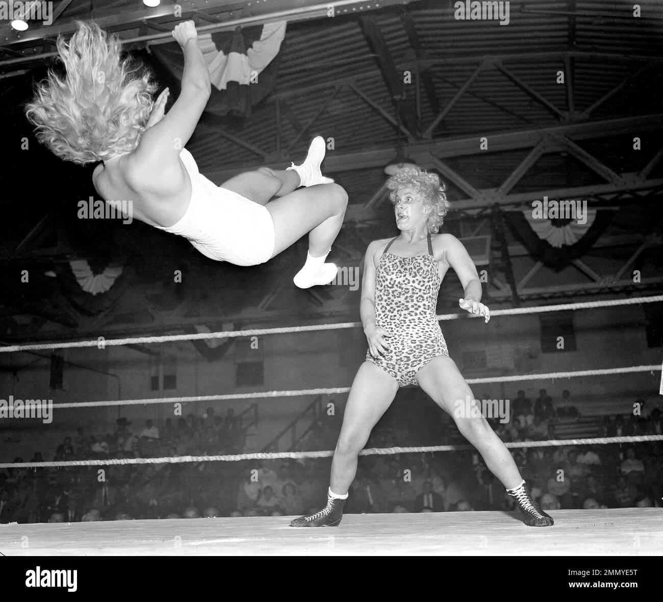 Leopard-suited Penny Banner sends Judy Glover through the air with a ...
