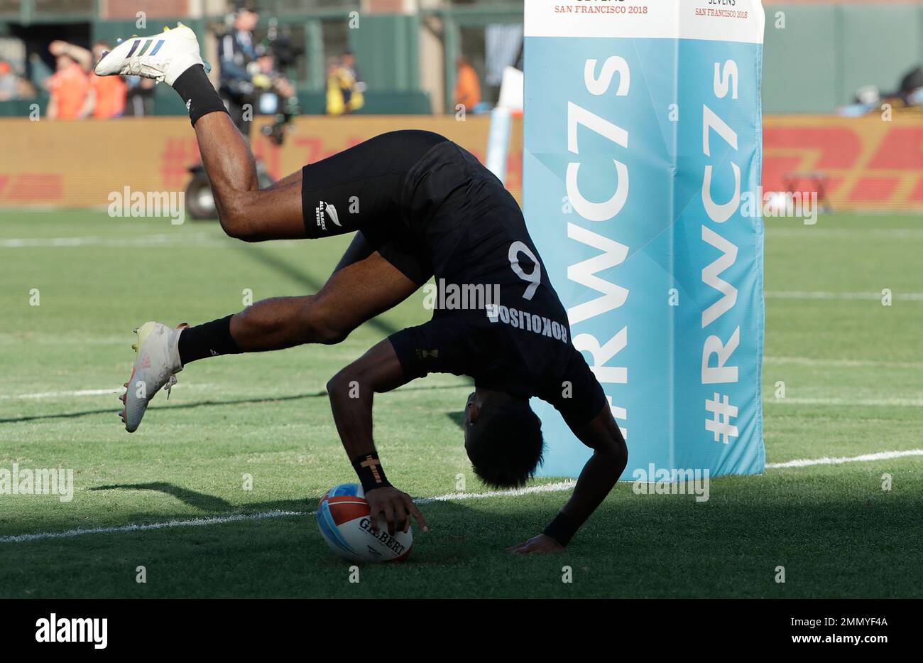 New Zealand's Akuila Rokolisoa flips forward while scoring against ...