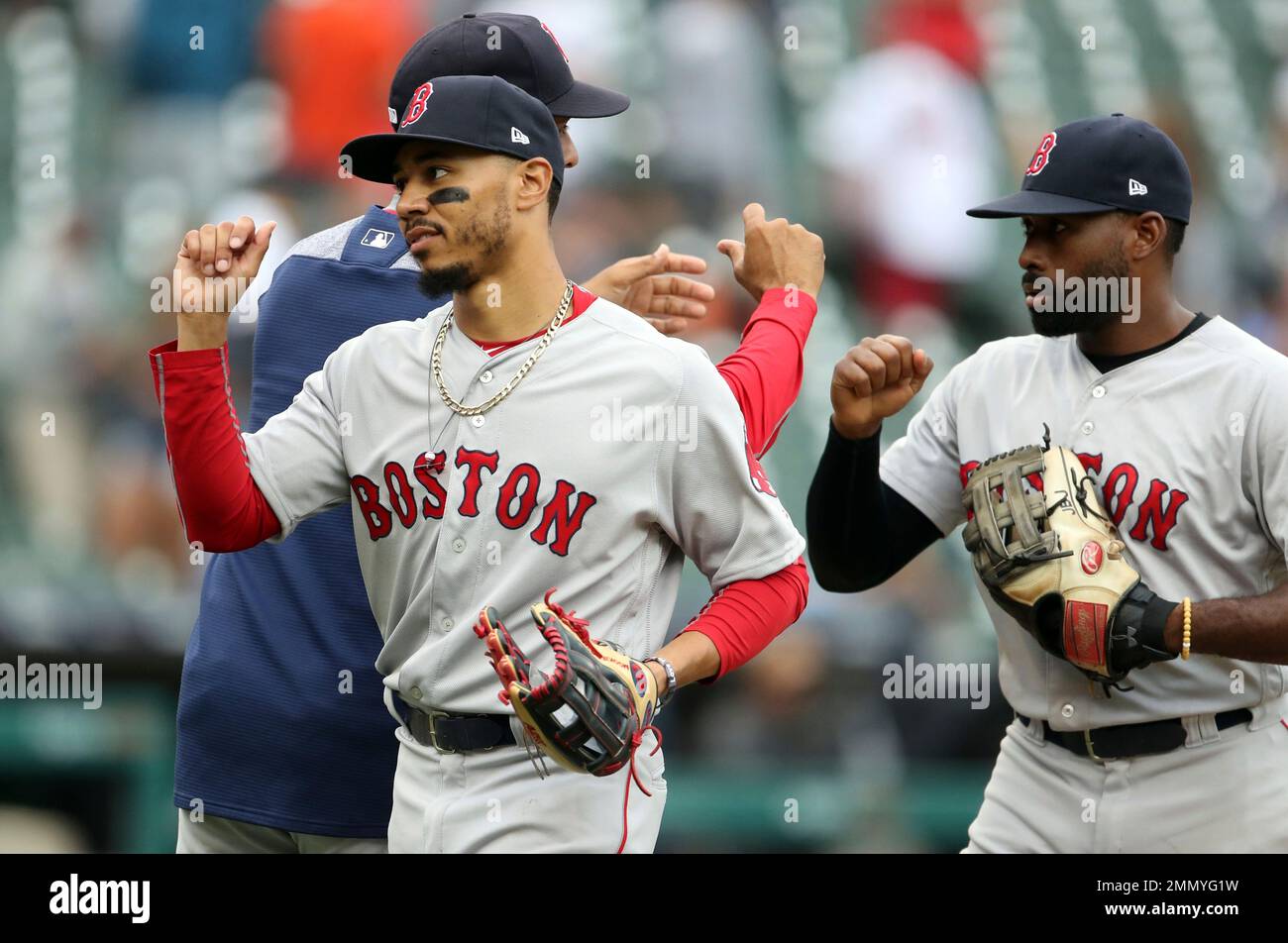 Boston Red Sox right fielder Mookie Betts, front left, and center ...