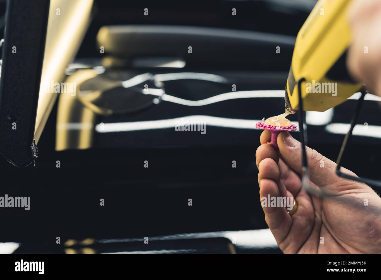 Expert auto mechanic. Removal of dents defects without painting on car ...