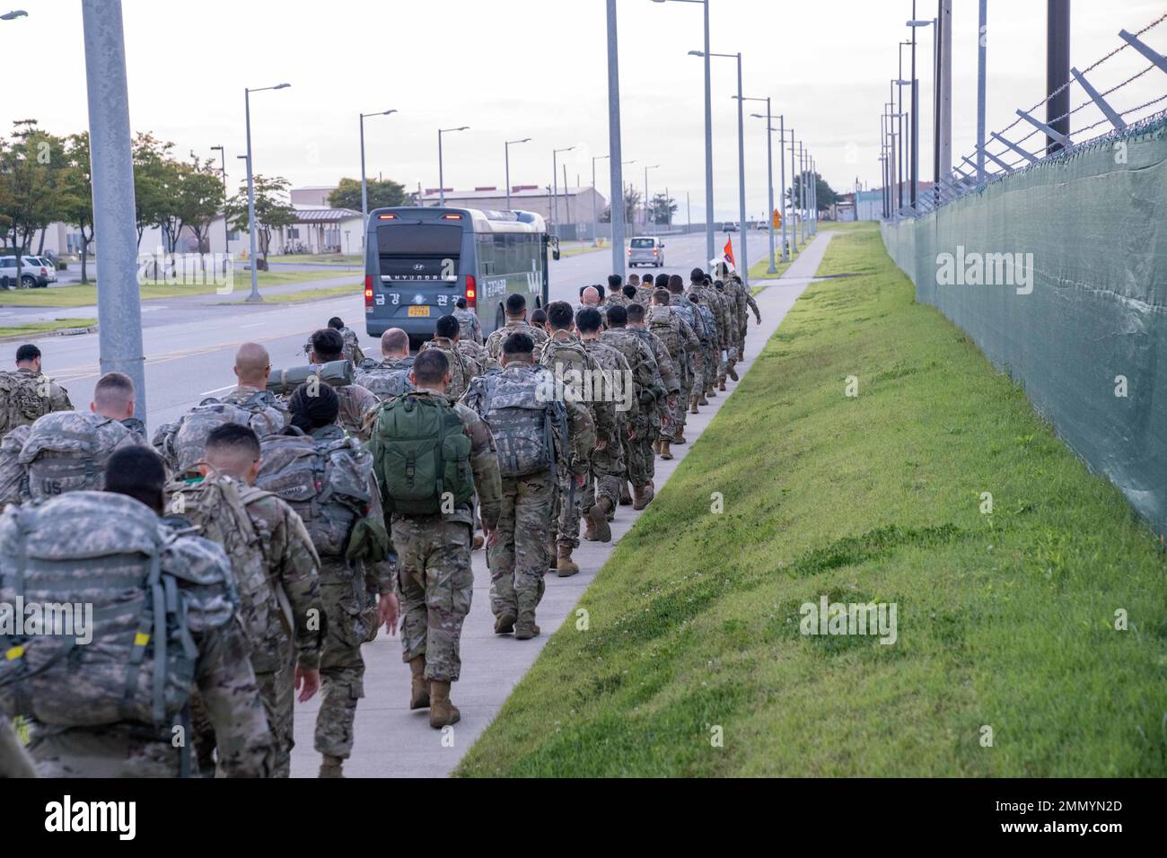 Soldiers in Headquarters Company participate in a ruck march for their ...
