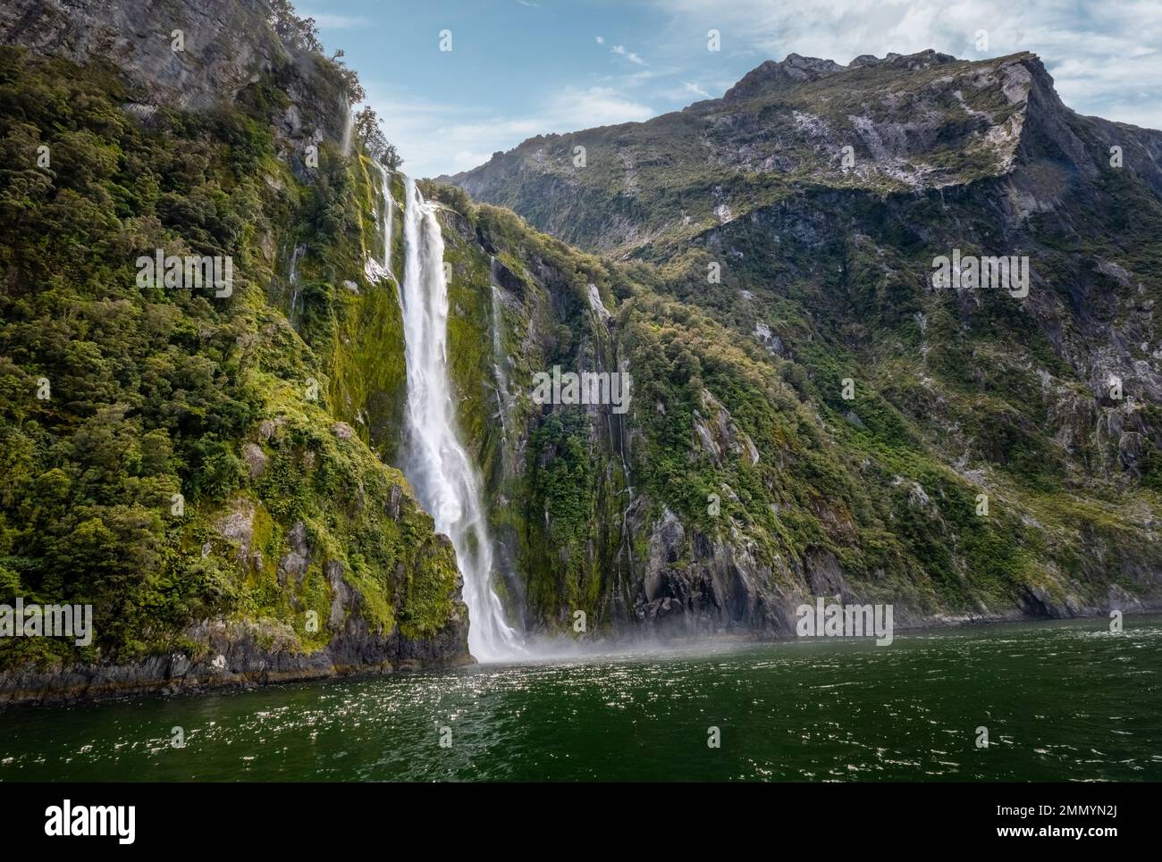 Stirling Falls cascading into Milford Sound on the South Island of New ...